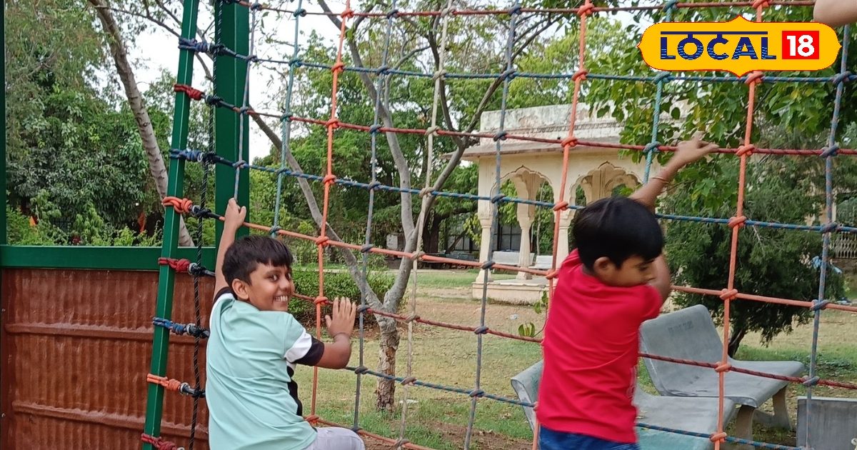 There is a huge crowd of children in the play zone of Central Park of ...