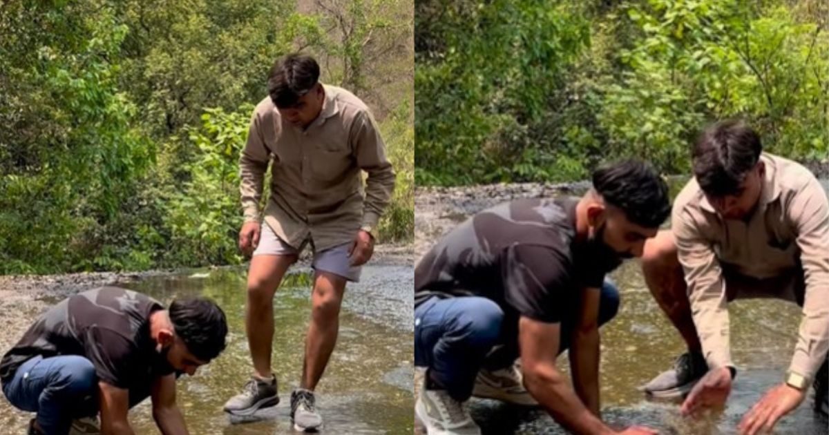 men stop pakistan water by hands stop drops of water flowing on road ...