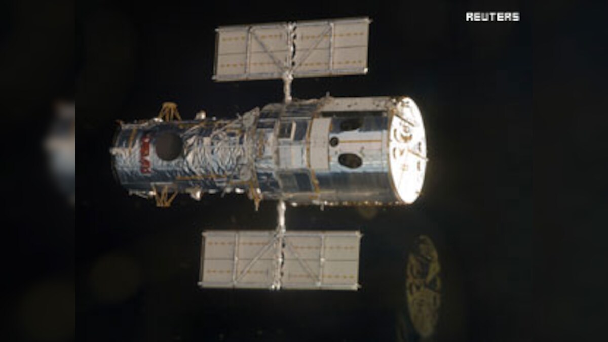 Astronauts installing new camera on Hubble - News18