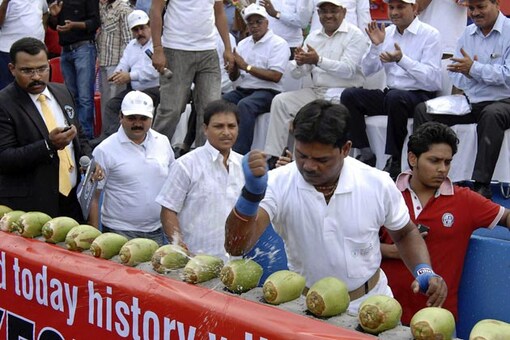 Snapshot: World record for breaking coconuts - News18