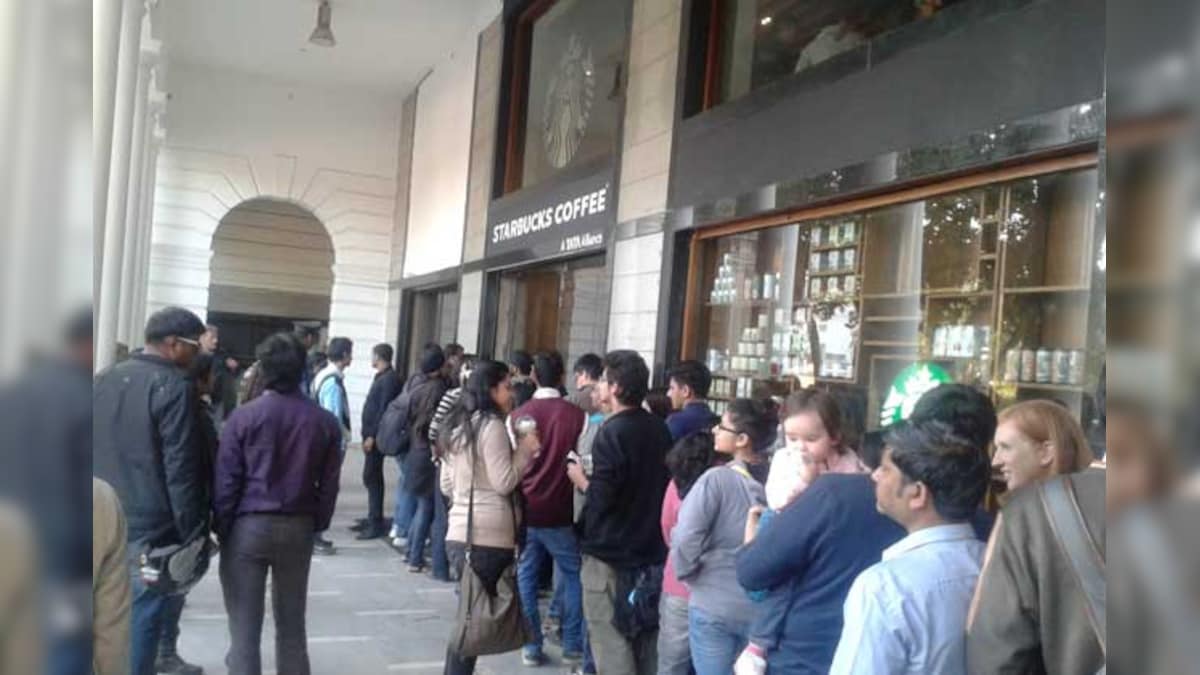 Long queues, but smiles welcome Starbucks to the heart of Delhi