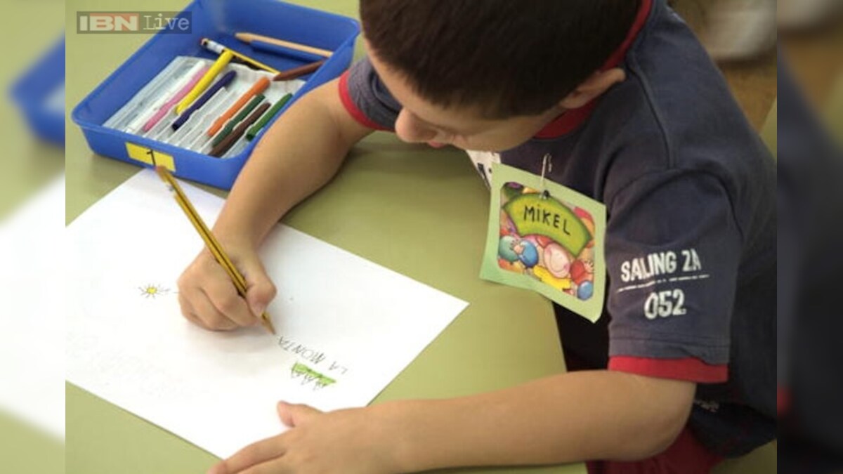 A robotic arm that helps children to improve handwriting - News18