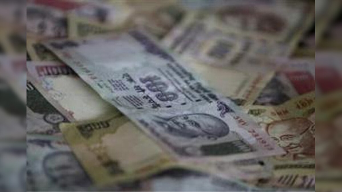 Indian rupee slips 11 paise, opens at 61.67 vs US dollar - News18