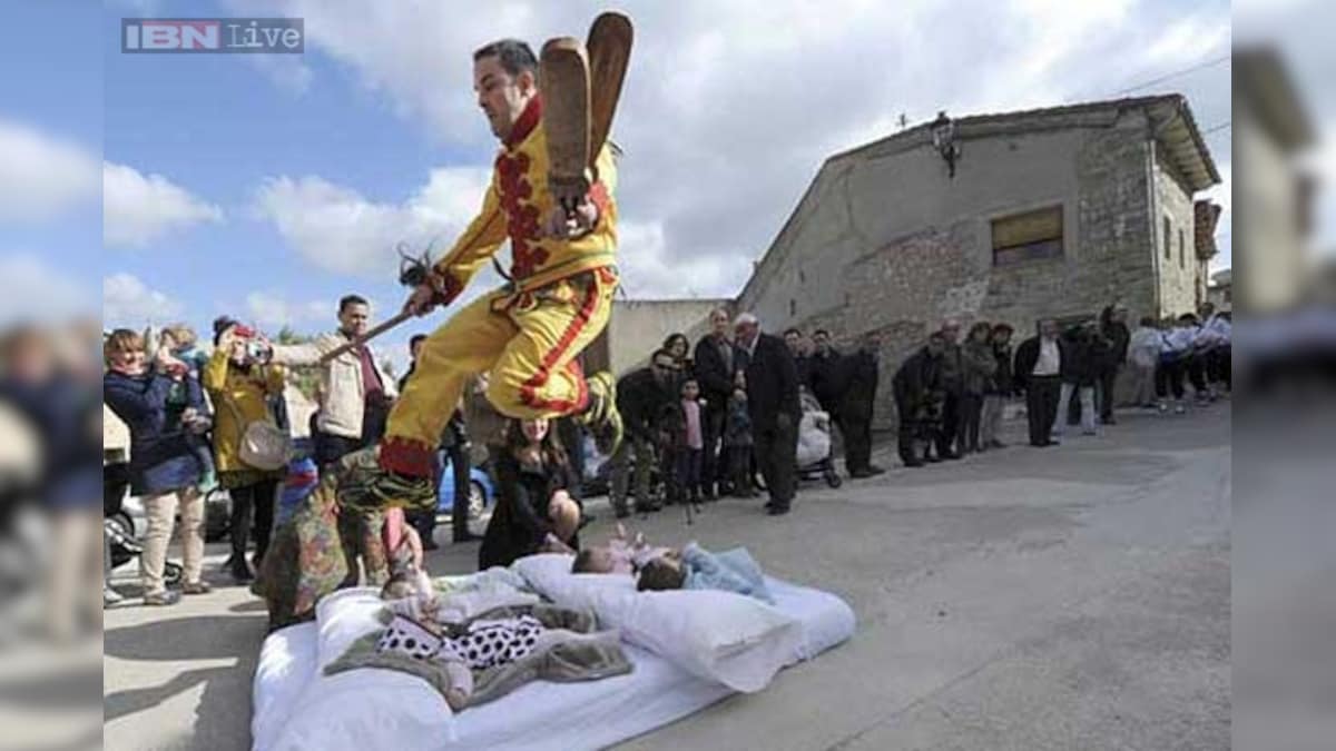 Photos: The 'devil' jumps over 1-year-old babies to wash away their ...