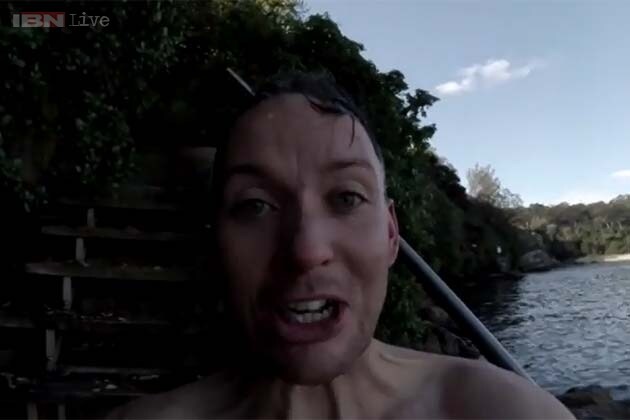 Man with a GoPro cliff jumps into the Sydney Harbour, barely misses ...