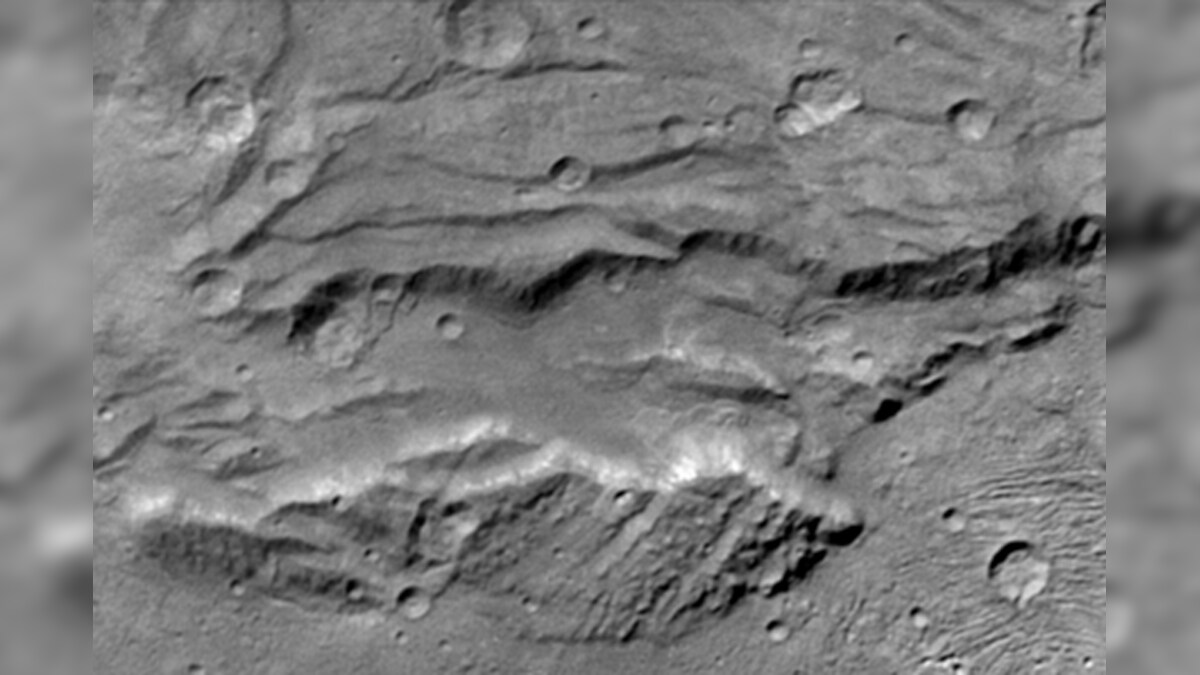 NASA reveals frozen ocean on Pluto's hulk-like moon Charon - News18