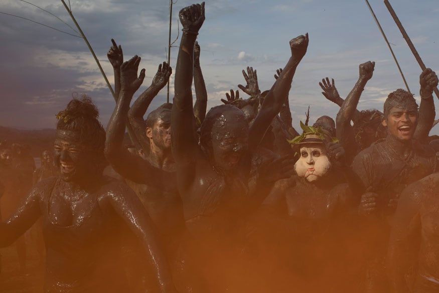 Revelers Getting Down and Dirty at Brazil's Mud Party - News18
