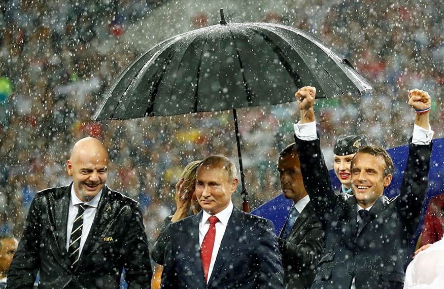 Vladimir Putin’s Umbrella Act Steals the Show at FIFA World Cup ...