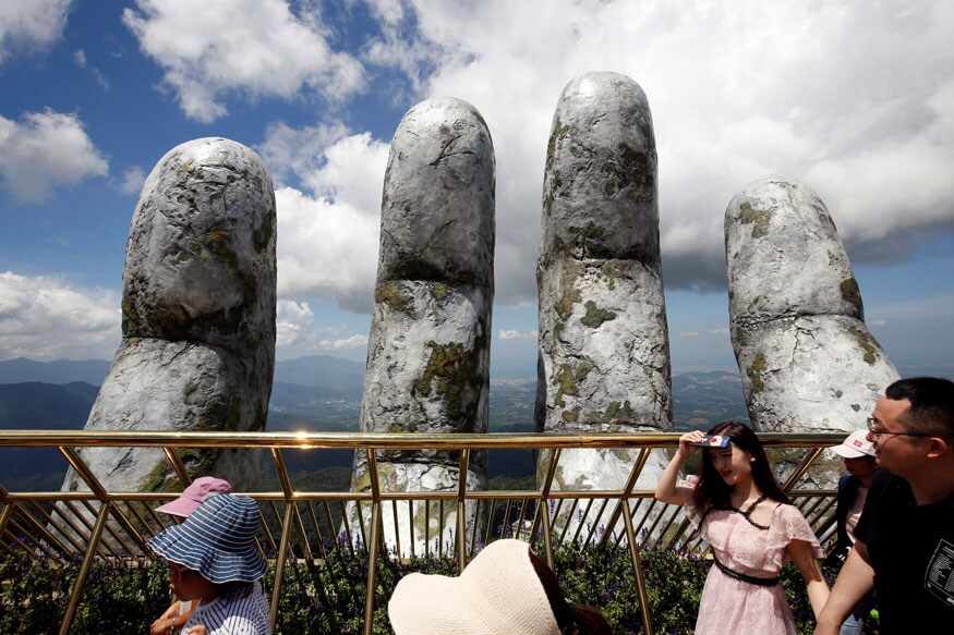 PHOTOS: Giant Hands Hold Vietnam's Golden Bridge - News18