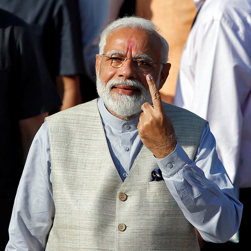 PHOTOS| PM Narendra Modi Casts His Vote in Ahmedabad - News18