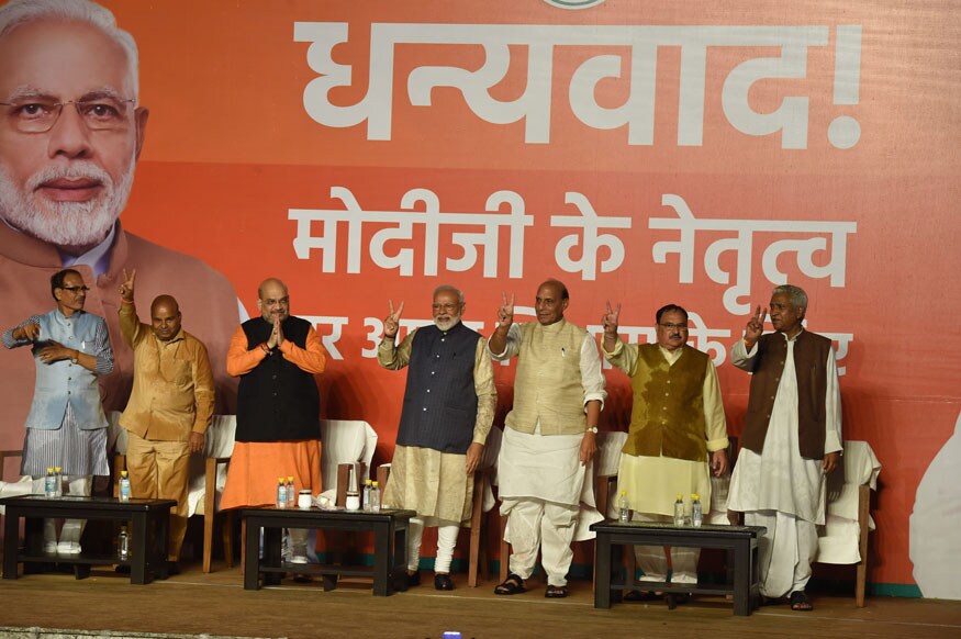 PHOTOS: Hero's Welcome for PM Narendra Modi at BJP HQ - News18