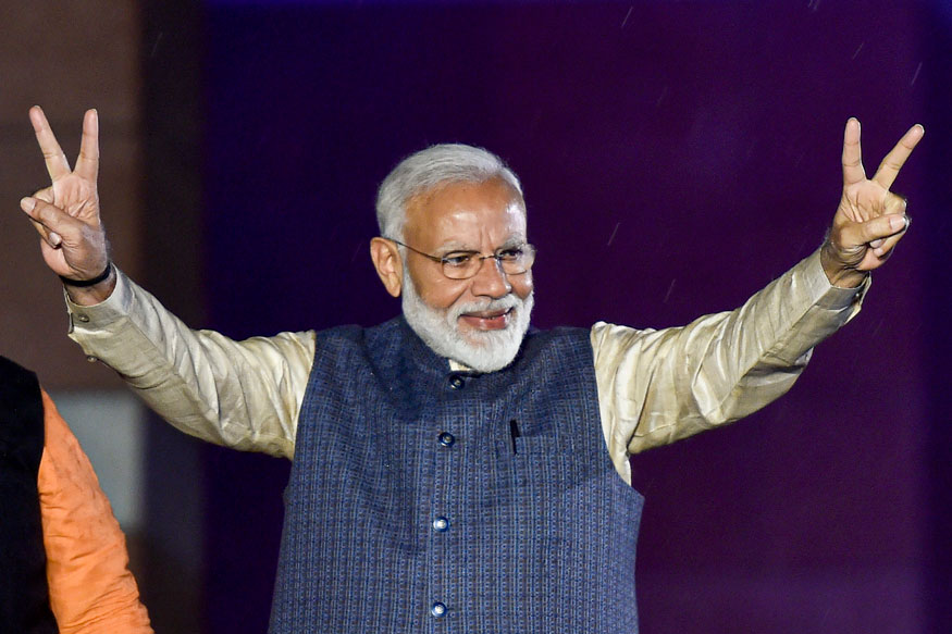 PHOTOS: Hero's Welcome for PM Narendra Modi at BJP HQ - News18