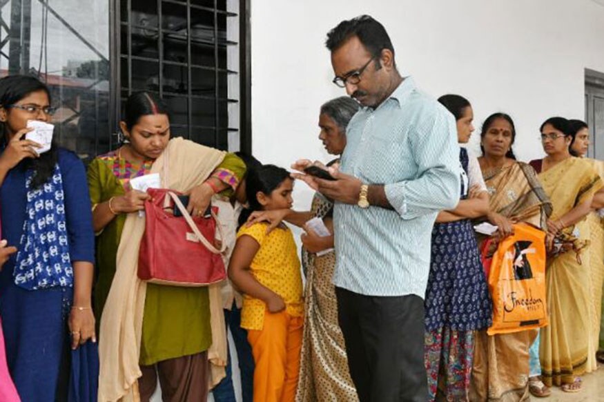 Voters in Kerala Beat Rain, Throng Polling Booths in Large Numbers - News18