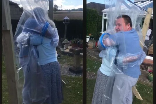 This 'Cuddle Curtain' Lets You Hug while Maintaining Social Distance ...