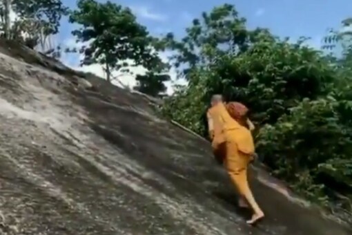 Monk Climbing up a Steep Mountain Without Any Safety Harness Will Blow ...