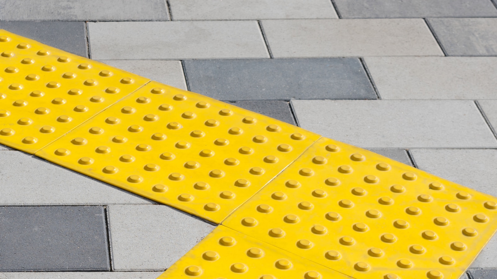 How Japan's Yellow Tenji Blocks Guide the Visually Impaired in Public ...