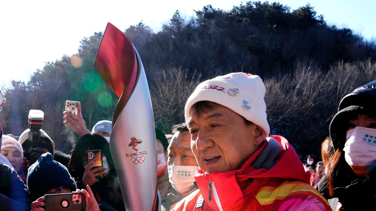Actor Jackie Chan Carries Olympic Torch Ahead of Beijing Winter Games ...