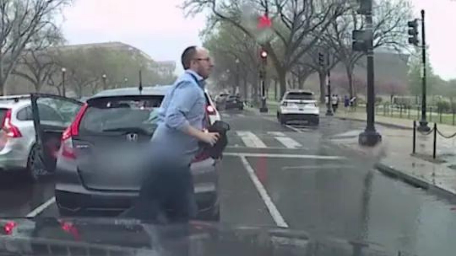 Watch: US Man Offers Stranger An Umbrella At Traffic Lights As It Rains ...