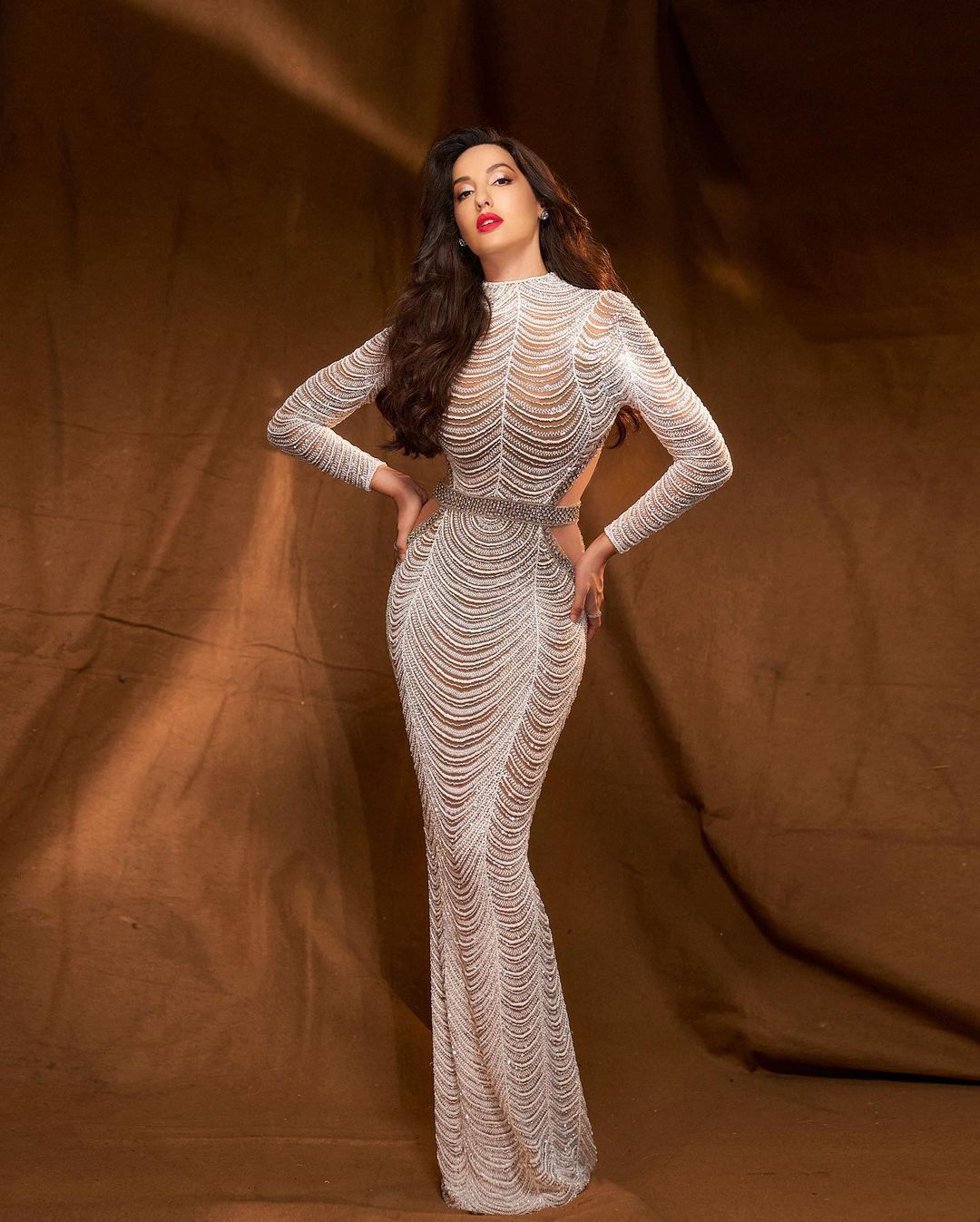 Nora Fatehi Looks Party Ready In Silver Sequin Dress With High Slit