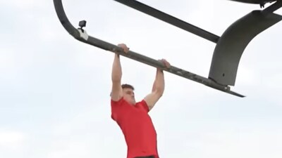 YouTubers Break Guinness World Record by Doing 25 Pull-Ups Hanging From ...