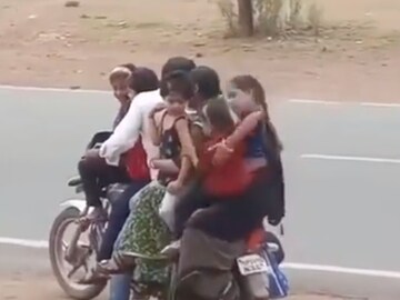 WATCH: Viral Video of Family of Seven Riding on One Bike Divides the ...