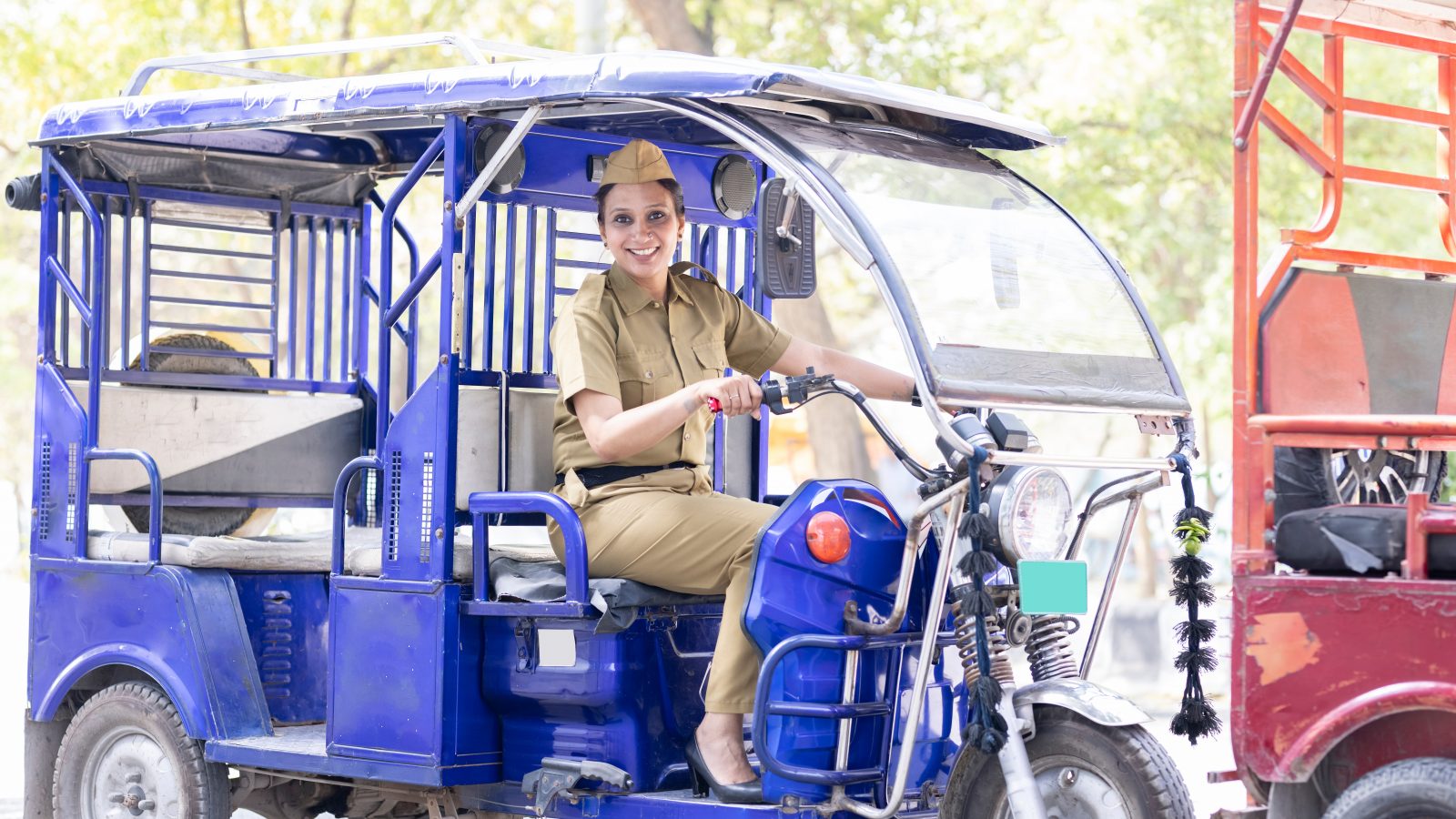Single Mother Drives E-rickshaw in Noida With Baby Strapped to Her ...