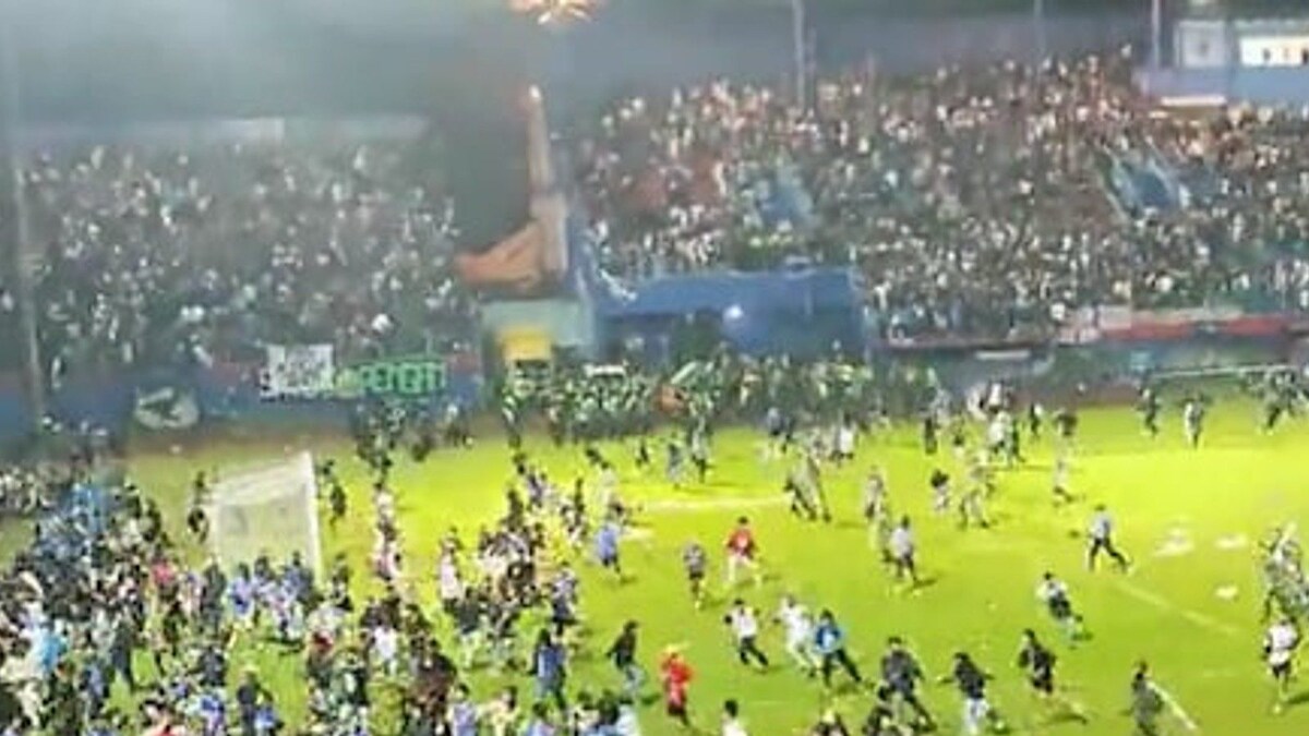Angry Fans Invade Pitch Leading to Stampede at Indonesia Stadium ...