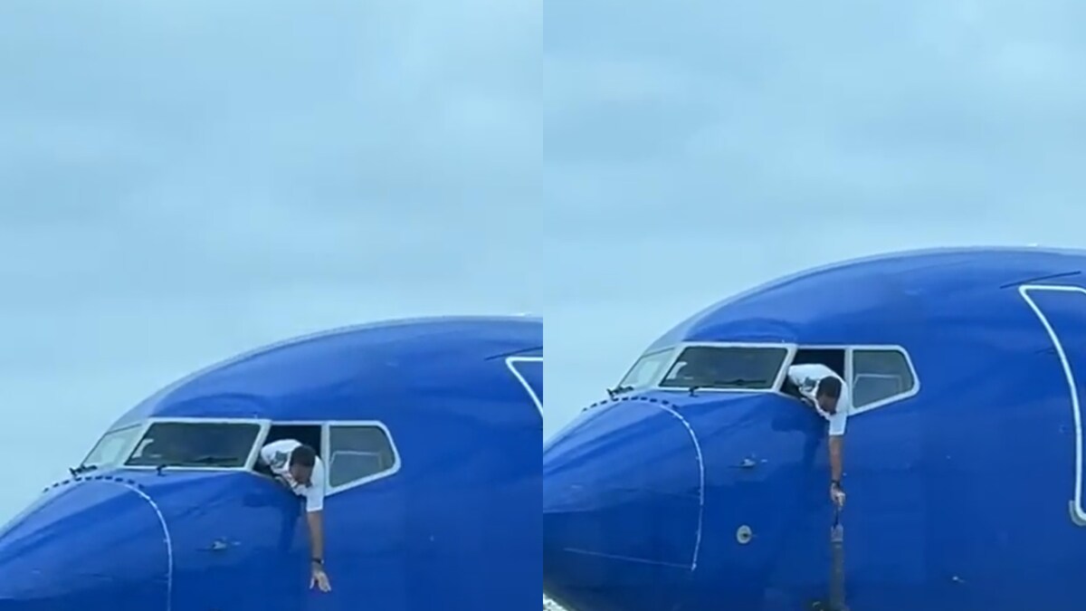 WATCH: Pilot Leans Out of Cockpit Window to Retrieve Passenger's Lost ...