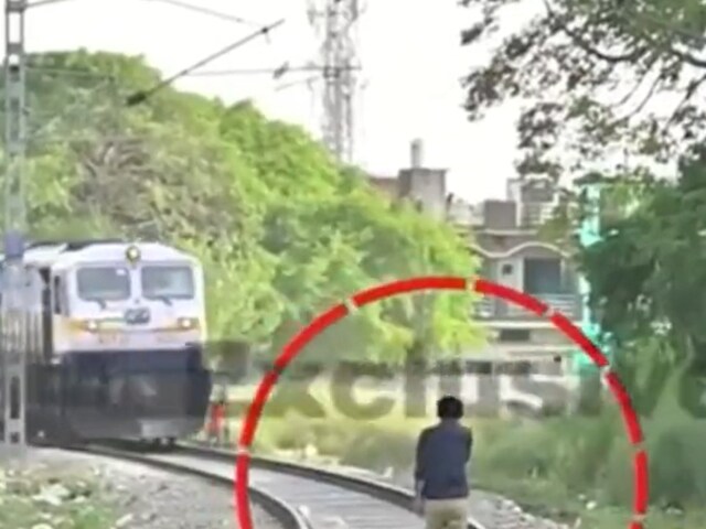 WATCH: Man Jumps on Railway Track to Stop a Moving Train, Here's What ...