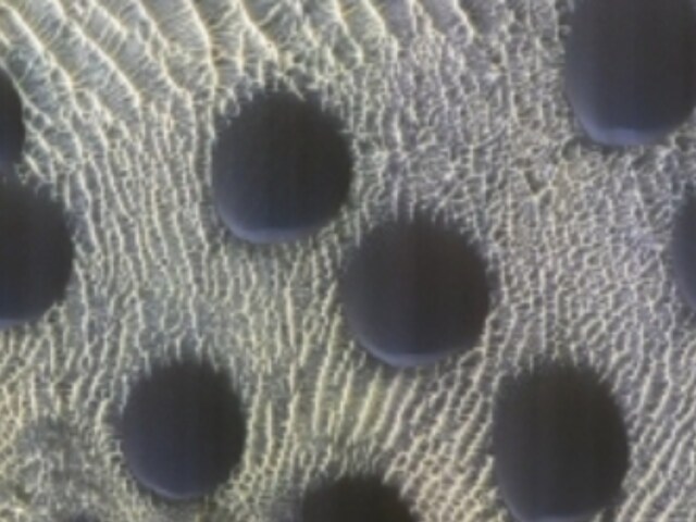 NASA Spacecraft Captures Unusual Circles of Sand Dunes on Mars - News18