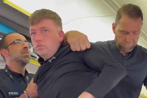 Watch: Flight Passengers Cheer As Police Remove 'Drunk' Man - News18