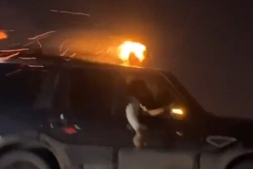 Caught On Camera: Gurugram Men Burst Crackers On Moving Car's Roof - News18 Caught On Camera: Gurugram Men Burst Crackers On Moving Car's Roof - News18