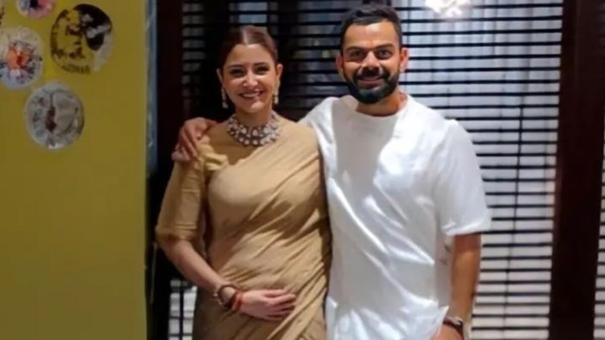 Pregnant Anushka Sharma Cradles Her Baby Bump In NEW Photo With Virat ...
