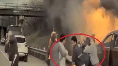 Watch: Good Samaritans Save Trapped Driver from Burning Car on ...