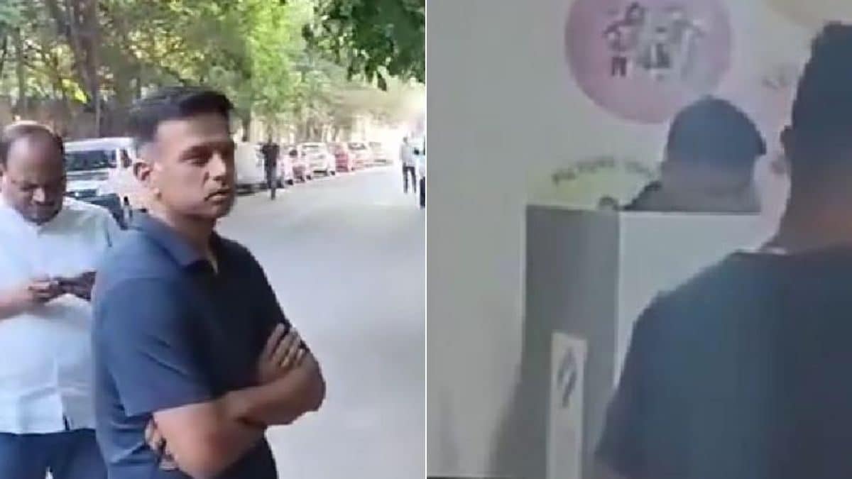 India Head Coach Rahul Dravid Waits in the Queue to Cast His Vote in ...