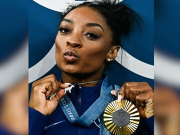 Simone Biles Flaunts the GOAT Necklace with 546 Diamonds: 'Haters Hate ...