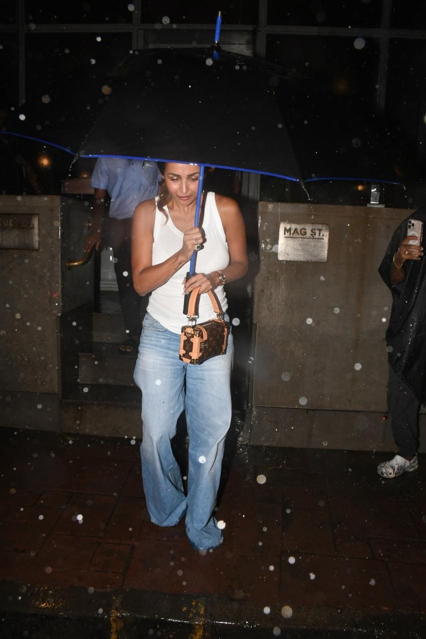 Malaika Arora Turns Heads In White Vest And Oversized Blue Denims, See Pics
