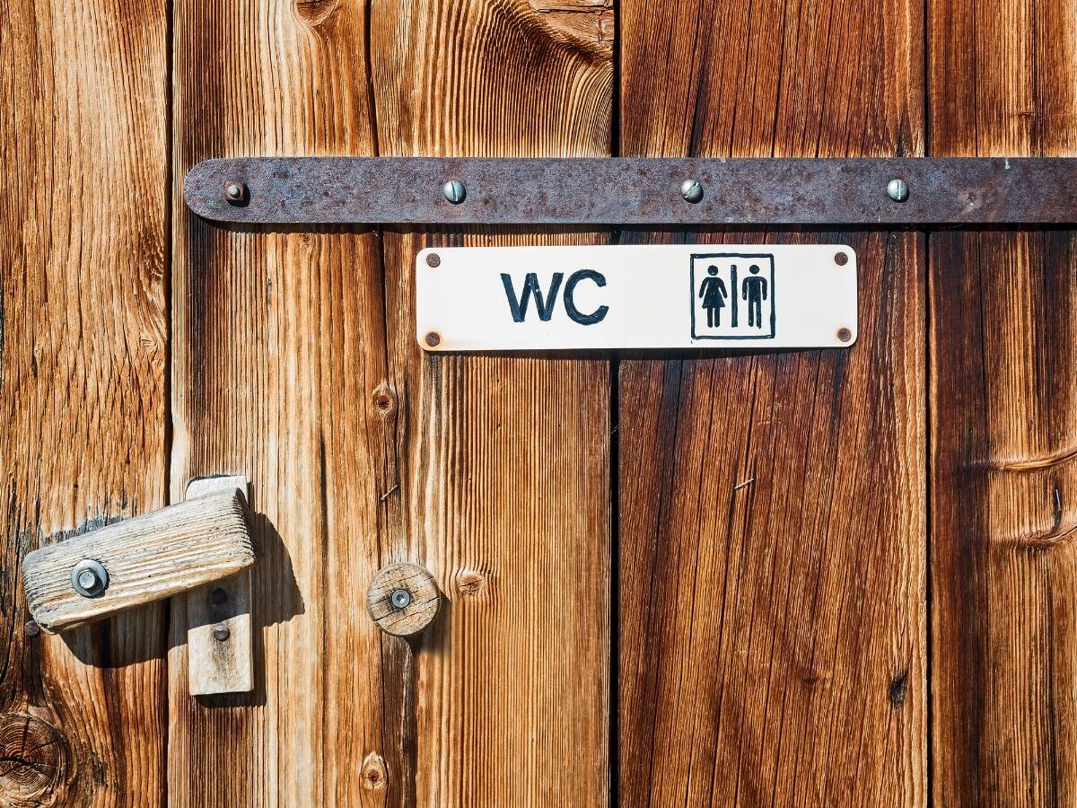 Ever Wondered Why It Says 'WC' On Toilet Signs? Here's What It Really Means