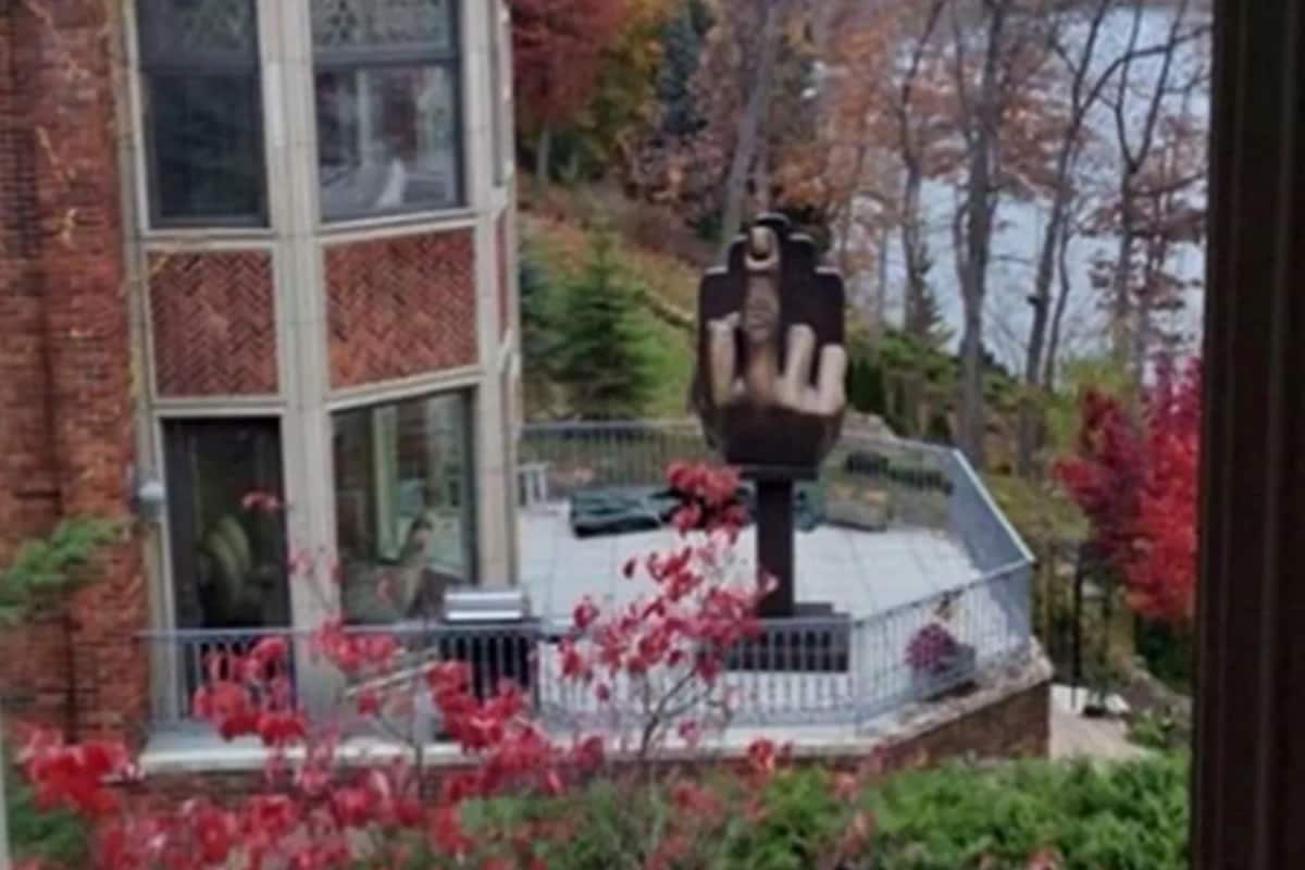 Strip club owner erects 12-foot bronze middle finger statue facing ex ...