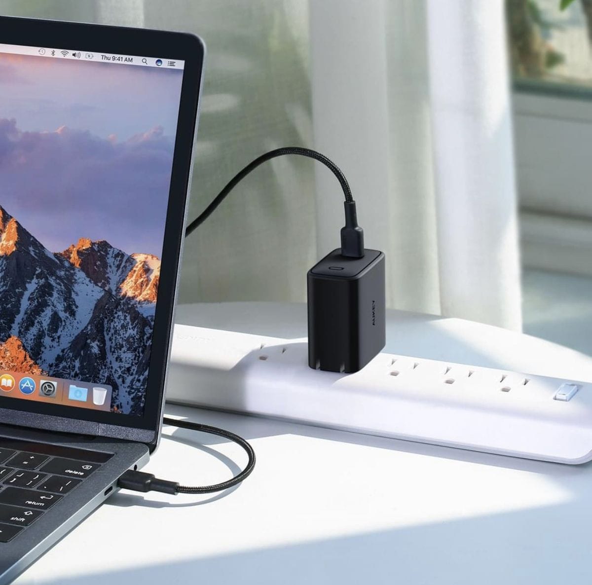 What Is That Cylinder On Your Laptop Charger? Here's Why It Matters