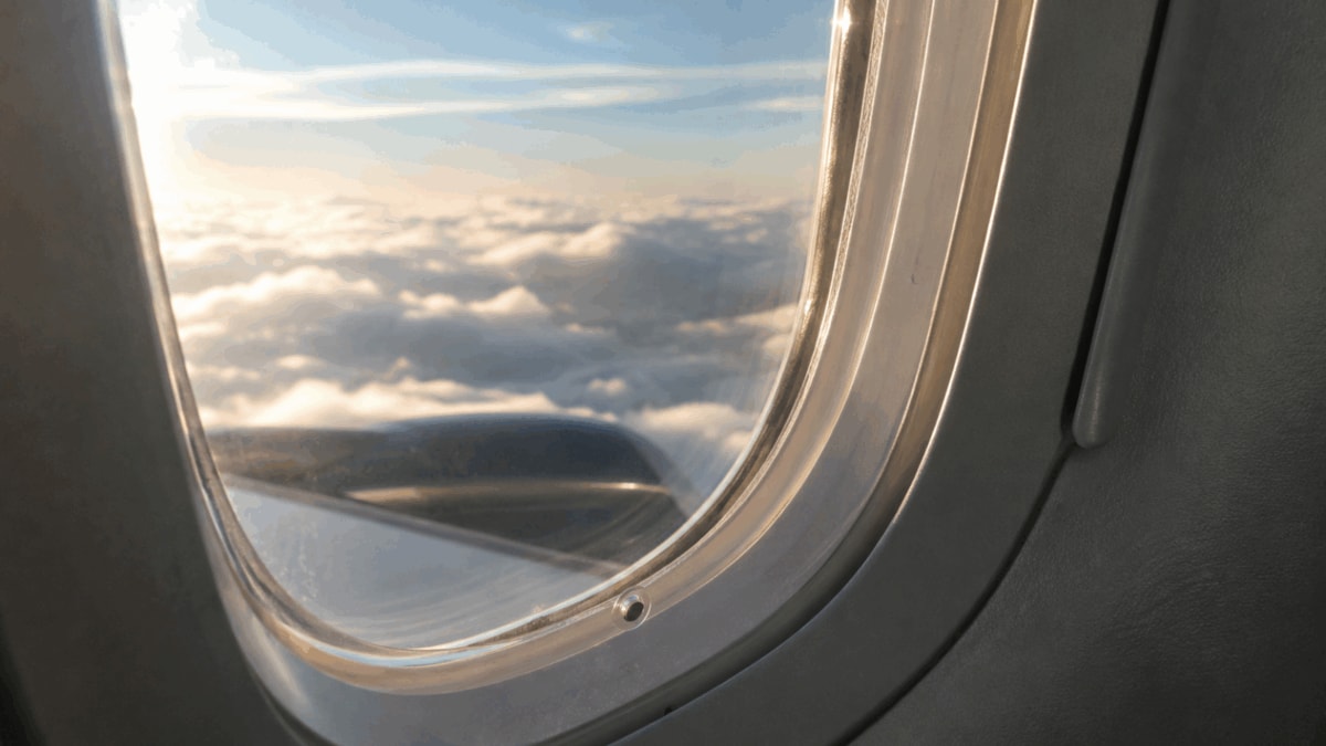 Why Do Airplane Windows Have A Tiny Hole? The Surprising Reason Behind It