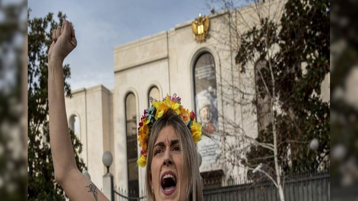 Against putin woman topless protest femen march at russian embassy to ...
