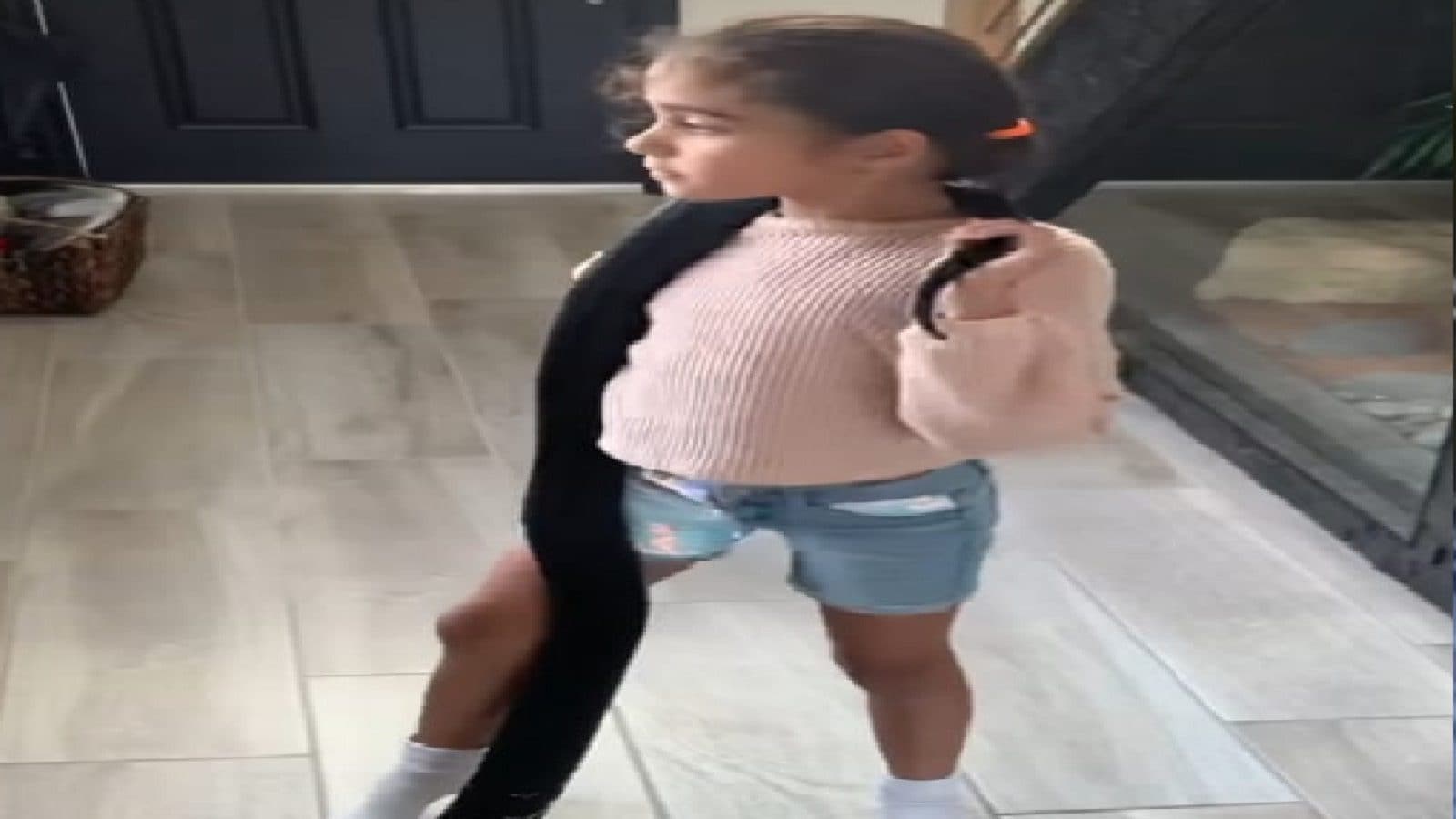 Little girl wrapped snake around her neck child playing with snake ...