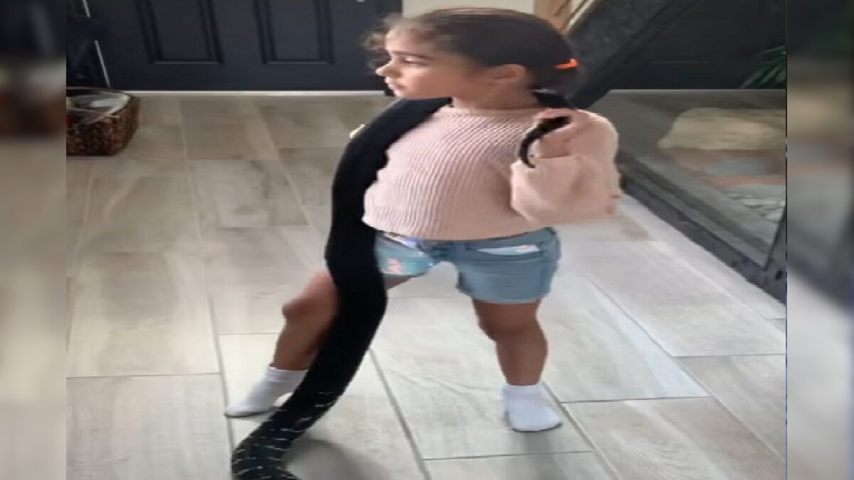 Little girl wrapped snake around her neck child playing with snake ...