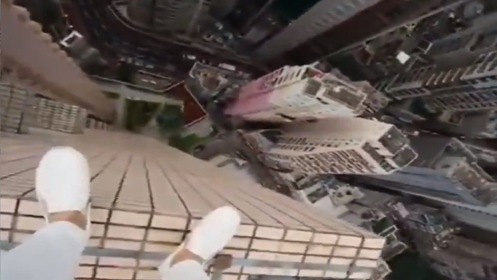 Man walking on high rise building railing dangerous stunt shocking ...