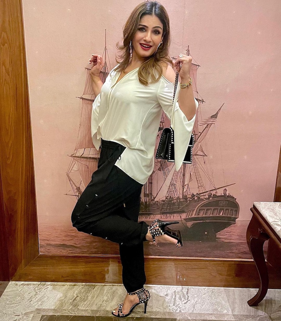 bollywood actress raveena tandon bold photoshoot as she shows cleavage ...